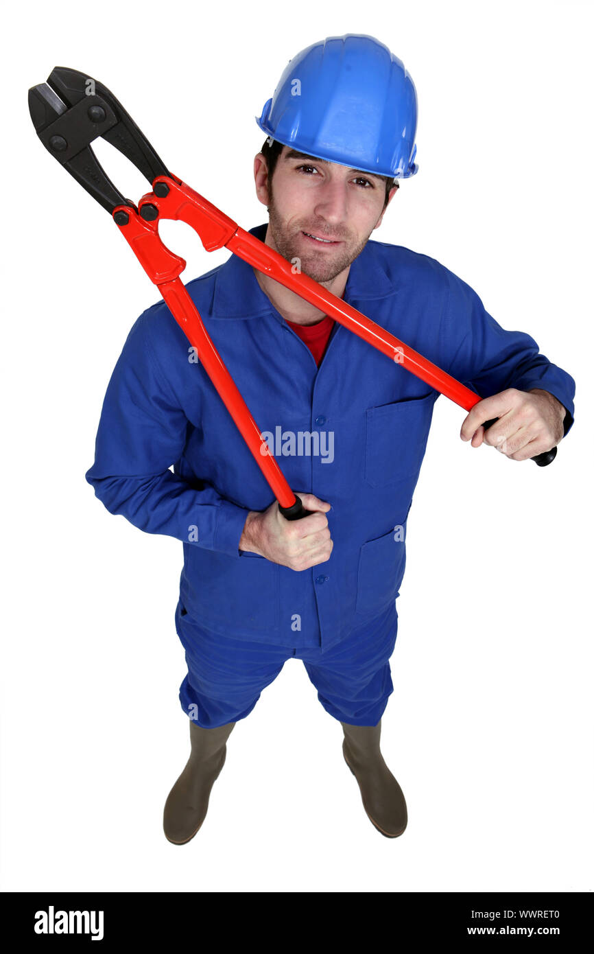Construction worker holding large pliers Stock Photo - Alamy