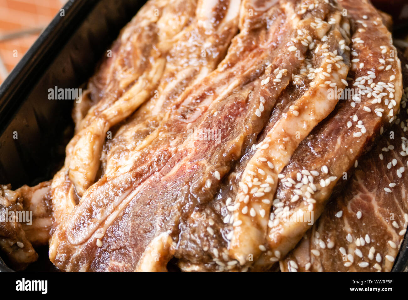 Bowl with stack of raw beef rib steaks Stock Photo - Alamy