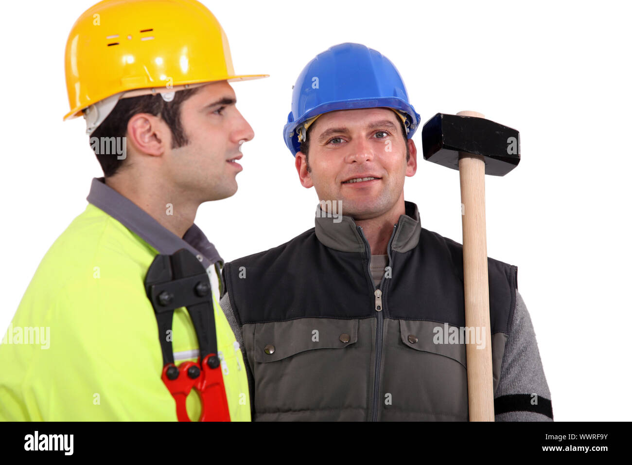 duo of male carpenters against studio background Stock Photo - Alamy