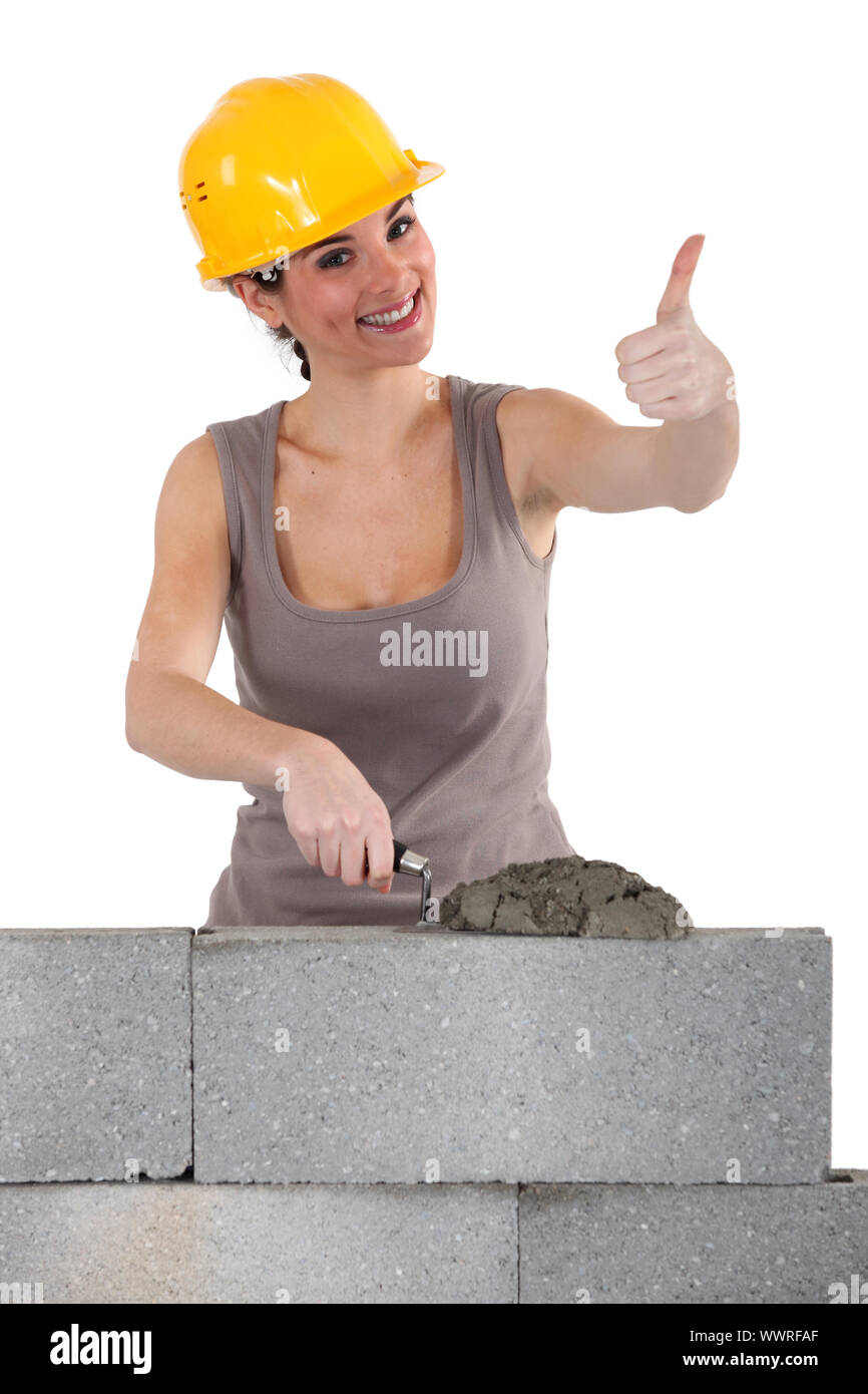 Bricklayer giving the thumb's up Stock Photo - Alamy