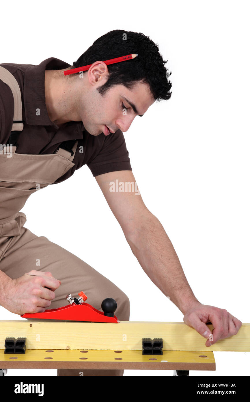 Man sanding plank of wood Stock Photo - Alamy