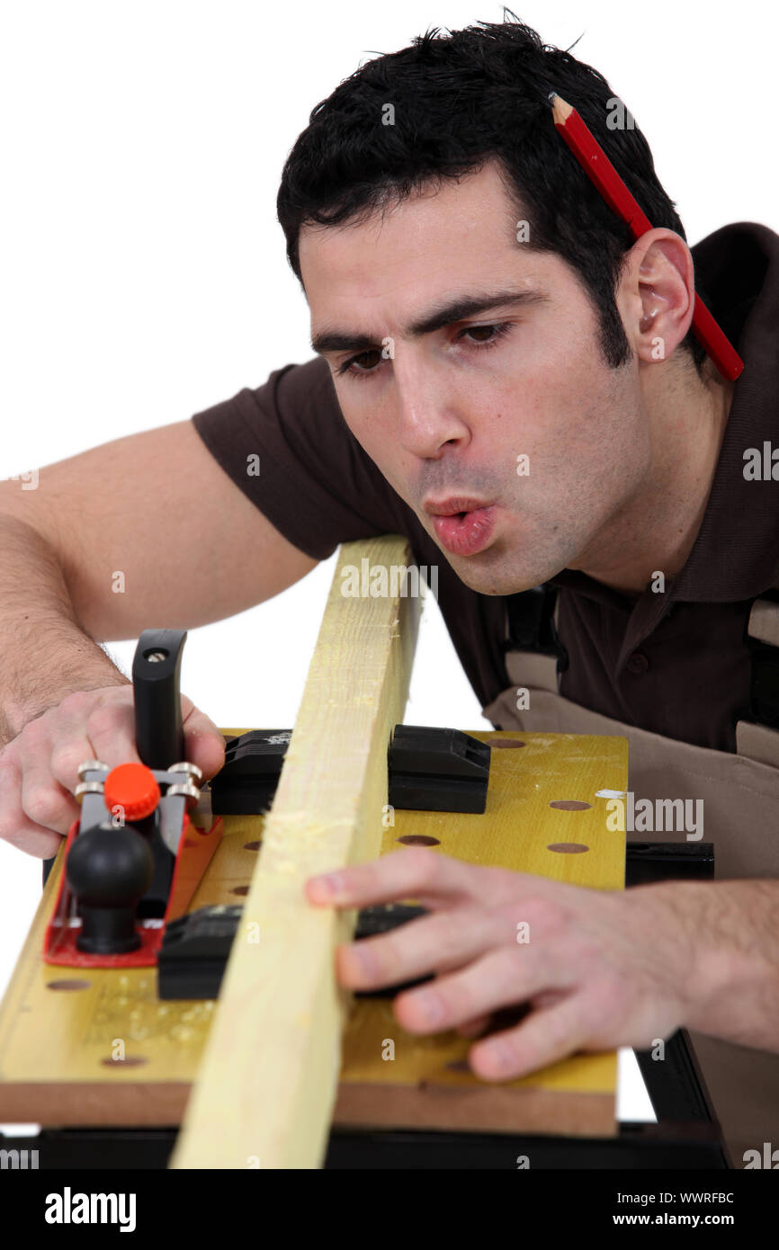 Carpenter planning timber Stock Photo - Alamy