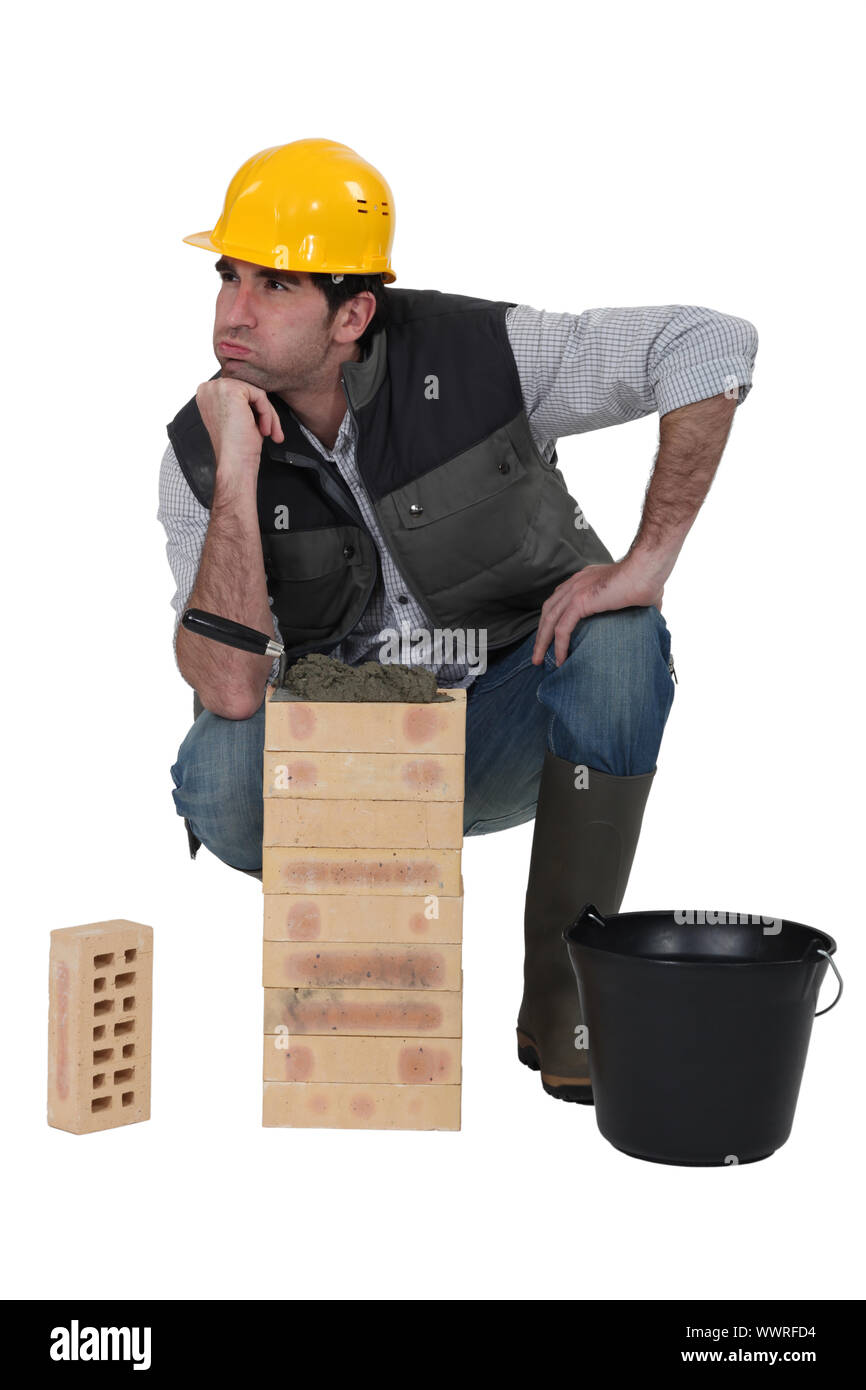 Male bricklayer with confused look on face Stock Photo - Alamy