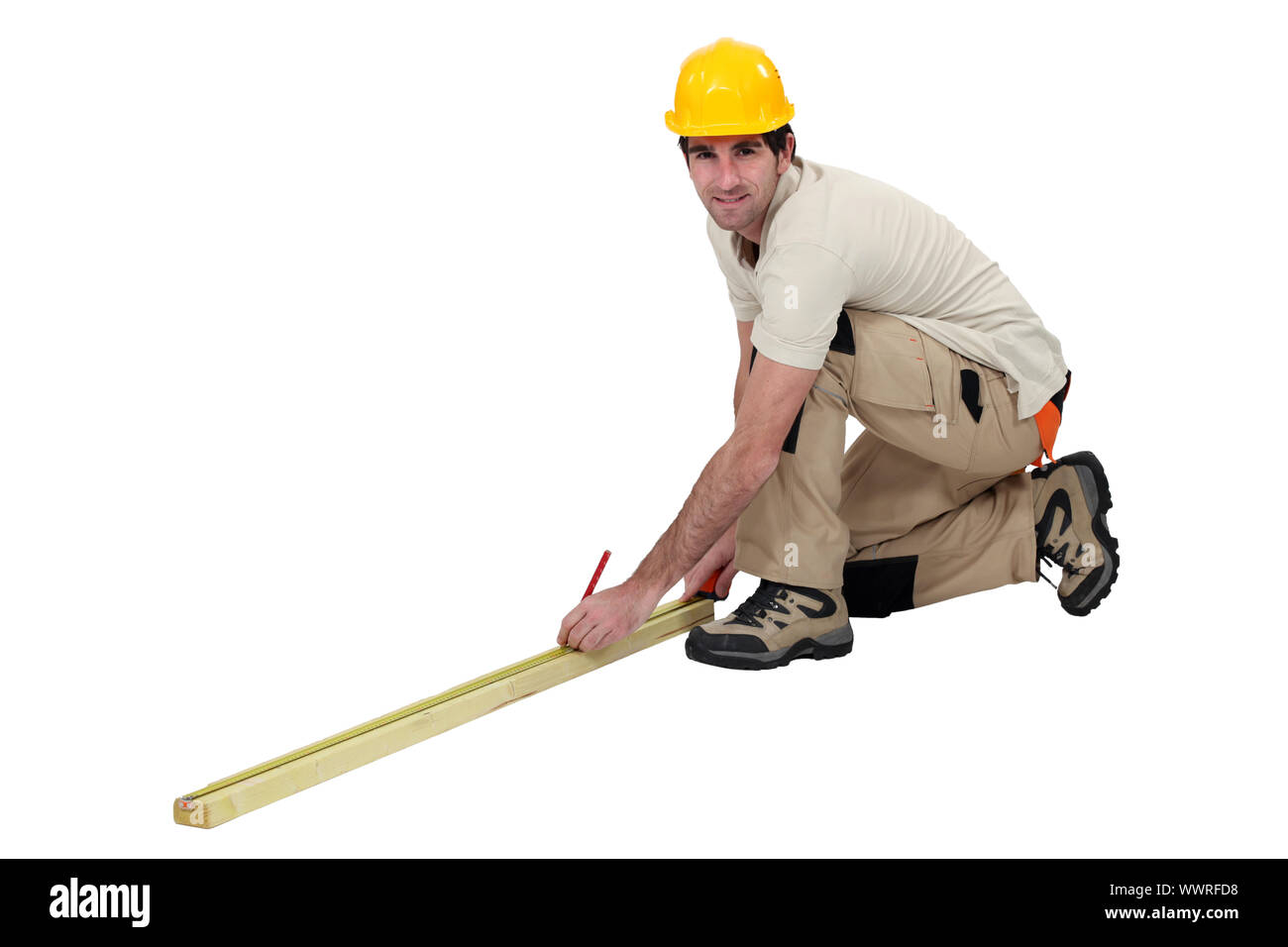 Workman taking measurements Stock Photo - Alamy