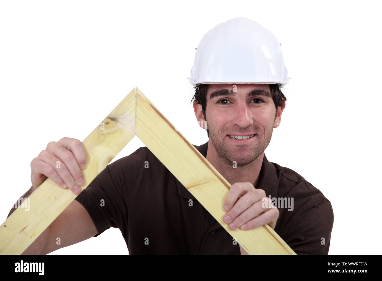 Man building wooden truss Stock Photo - Alamy