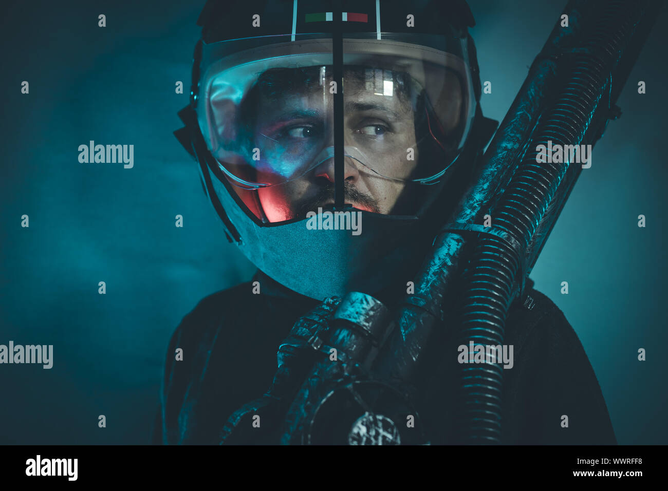 Space man with metal helmet and laser beam weapon Stock Photo - Alamy
