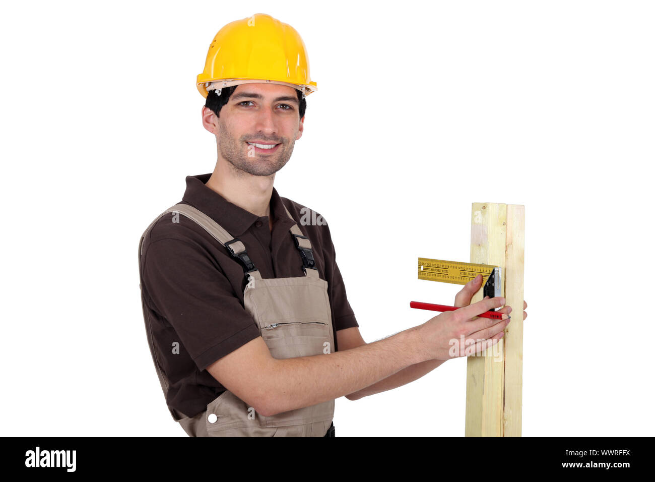 portrait of young carpenter taking measurements Stock Photo - Alamy