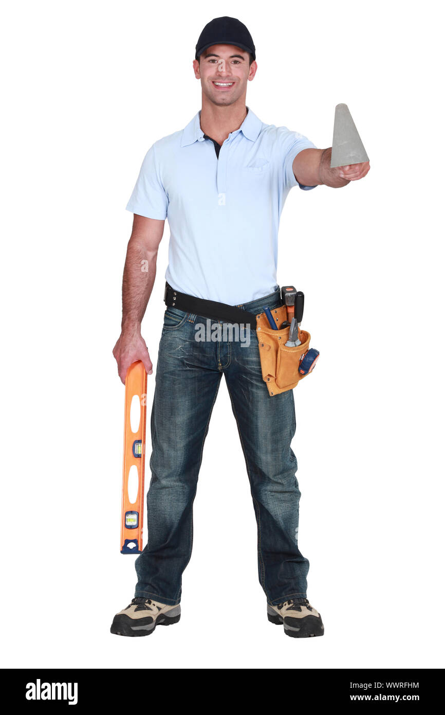 Tradesman posing for the camera with his tools Stock Photo - Alamy