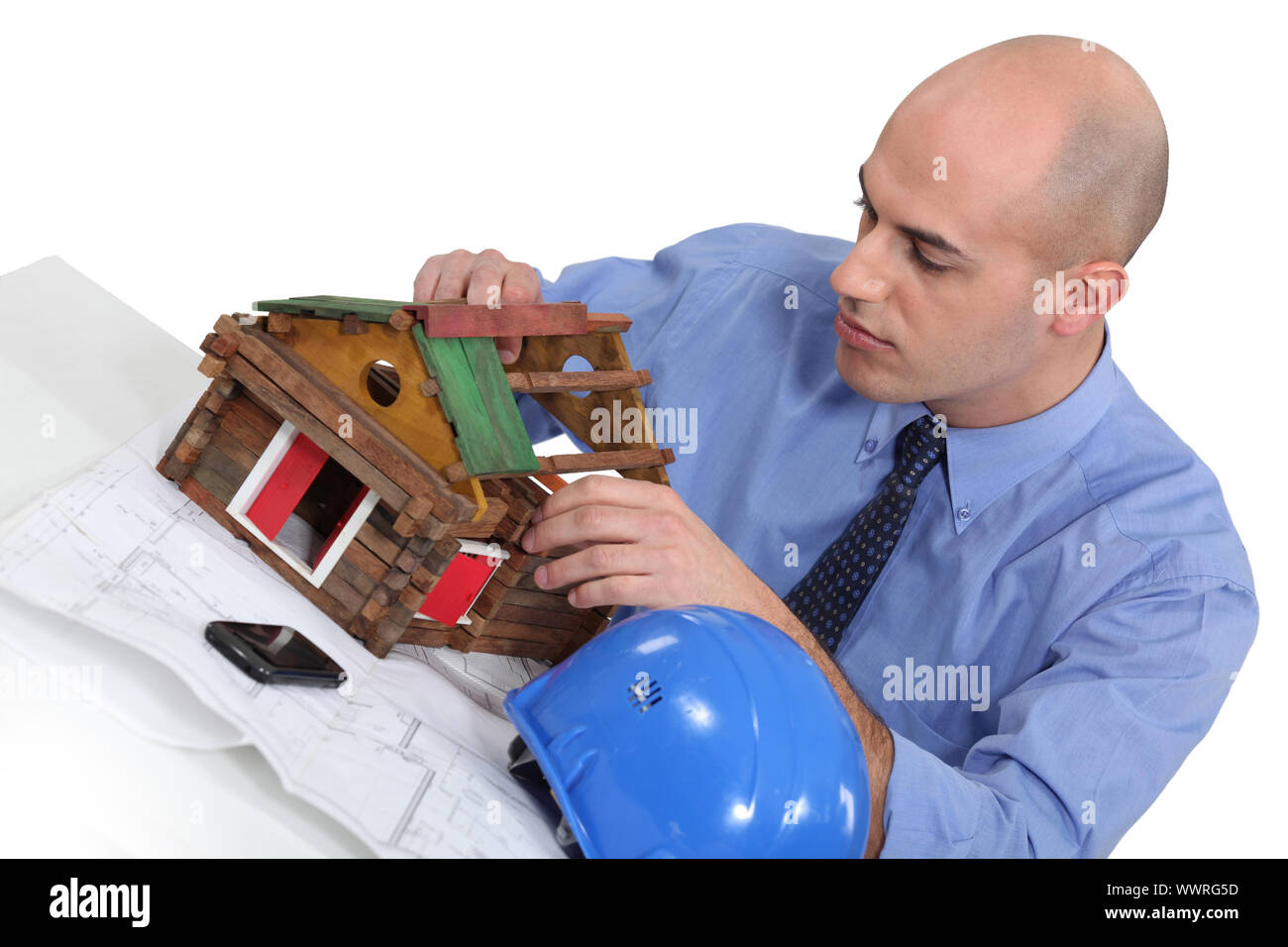 Man building a house model Stock Photo - Alamy