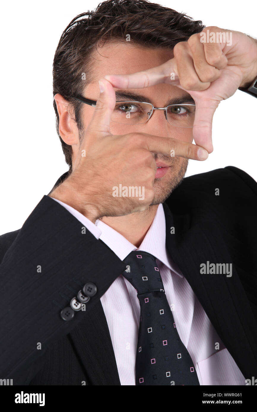 Businessman making a frame Stock Photo - Alamy