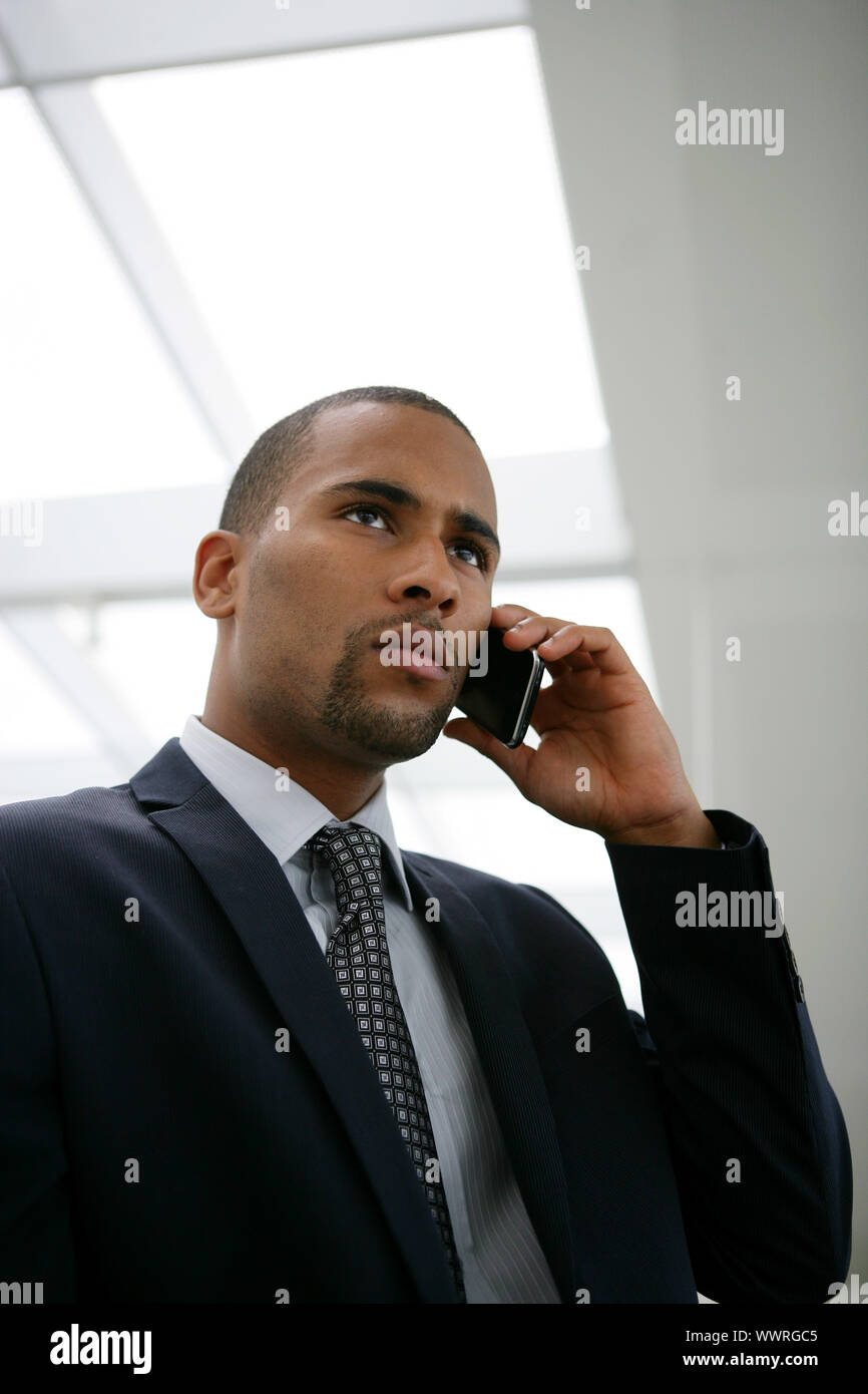 African businessman calling his boss Stock Photo - Alamy