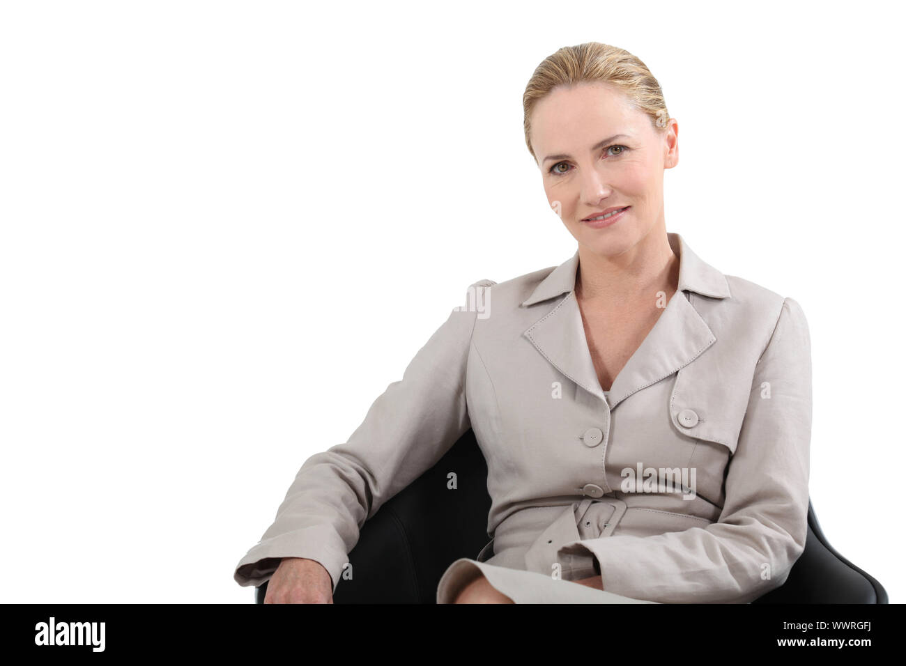 Female executive sitting in leather chair Stock Photo - Alamy