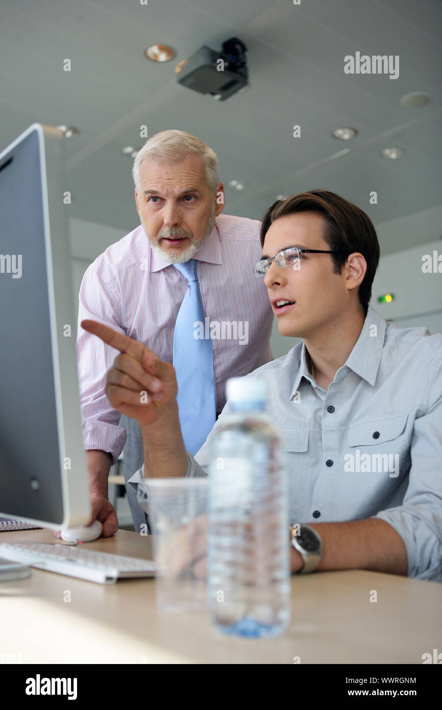 Teacher sitting facing camera hi-res stock photography and images - Alamy