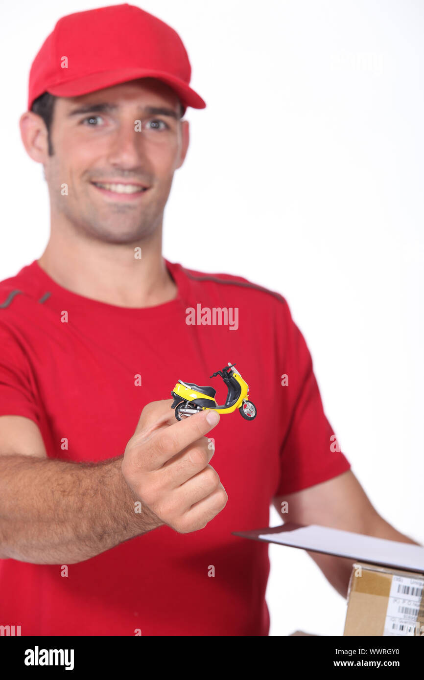 Man with a mini toy scooter Stock Photo - Alamy