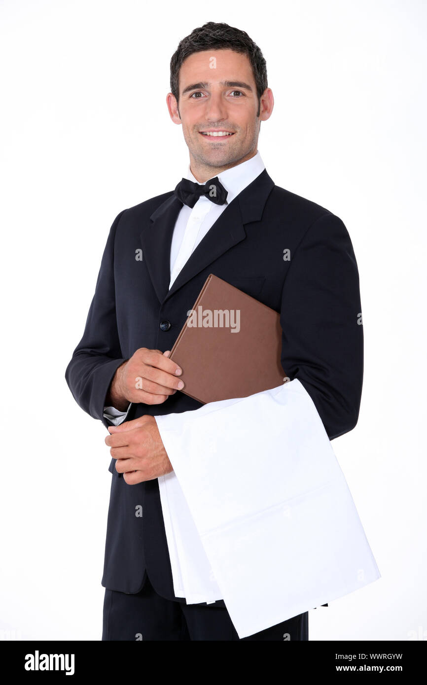 Well-dressed waiter holding menu Stock Photo - Alamy