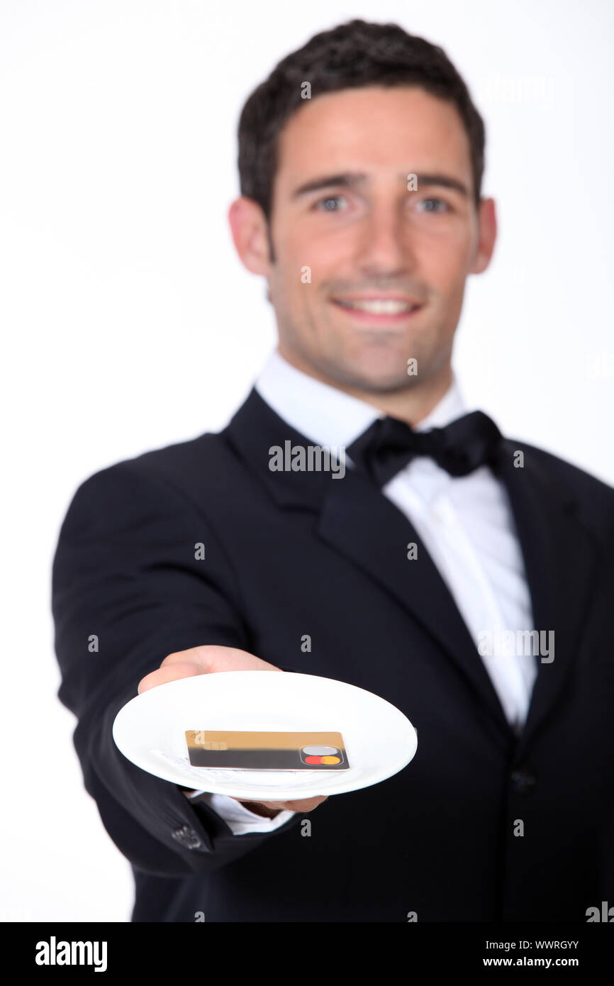 Waiter giving back credit card Stock Photo - Alamy