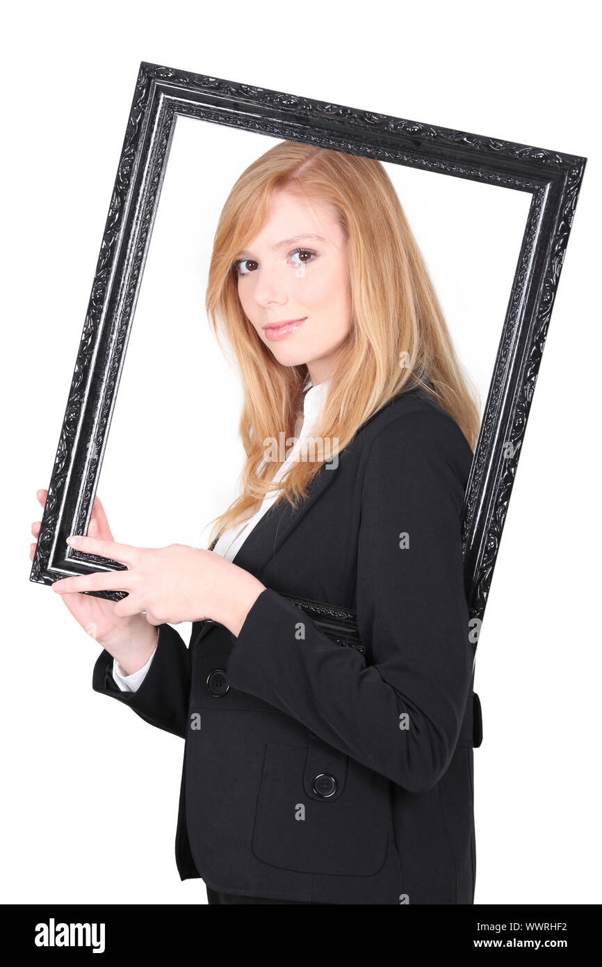 Redhead girl with black picture frame Stock Photo - Alamy