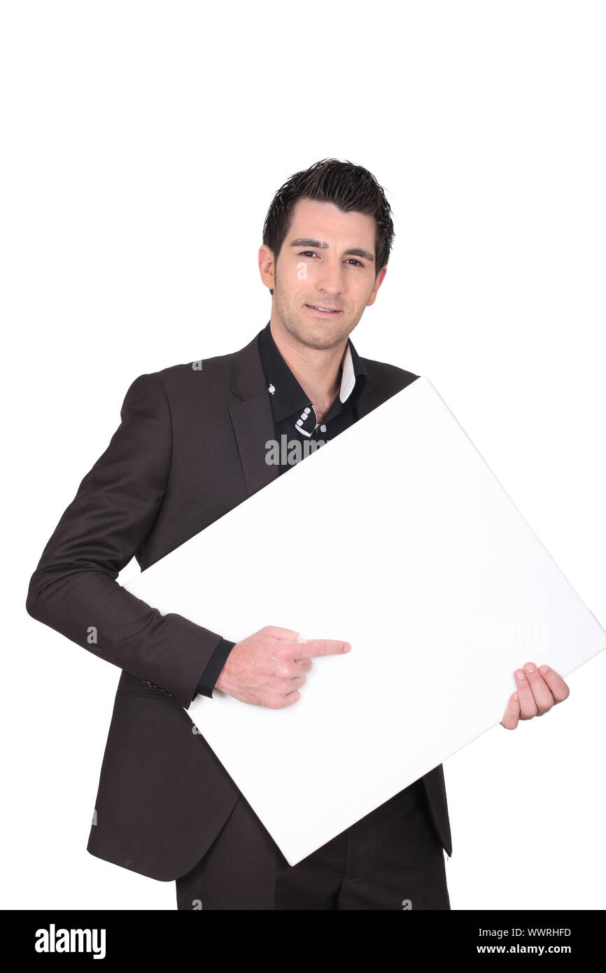 Man pointing to a blank sign Stock Photo - Alamy