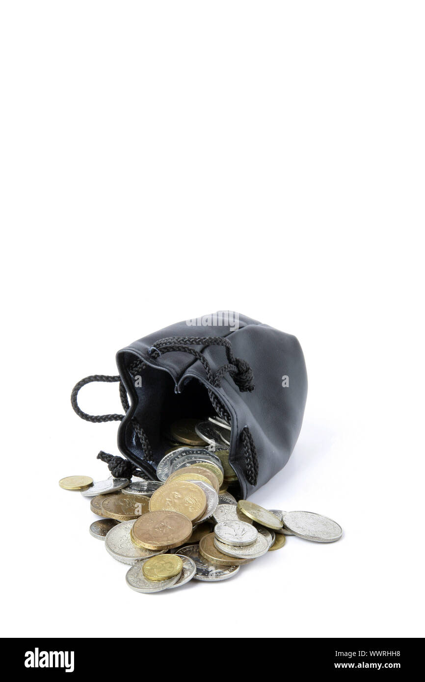 Coins spilling from purse Stock Photo - Alamy