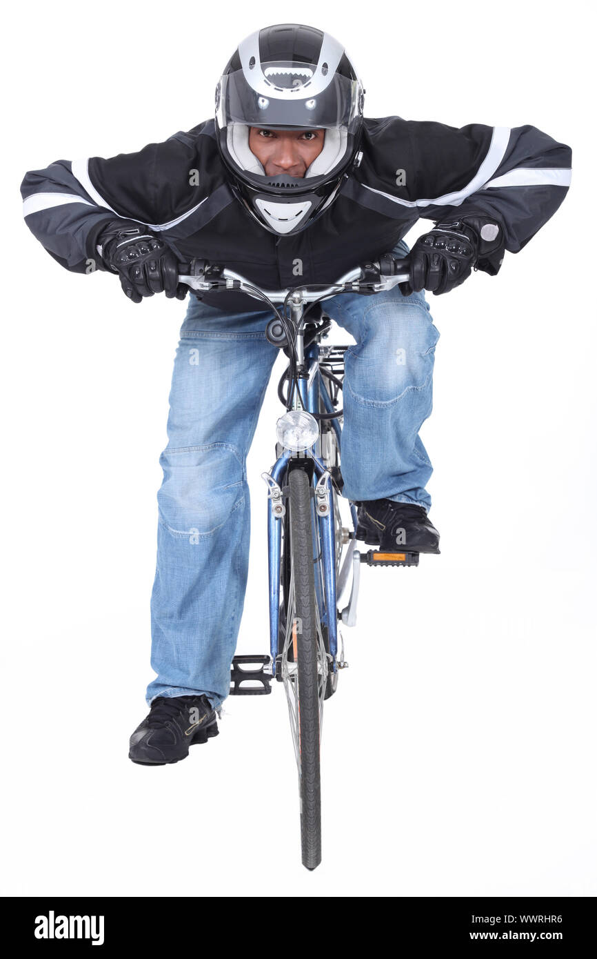 Motorcyclist on a push bike Stock Photo - Alamy