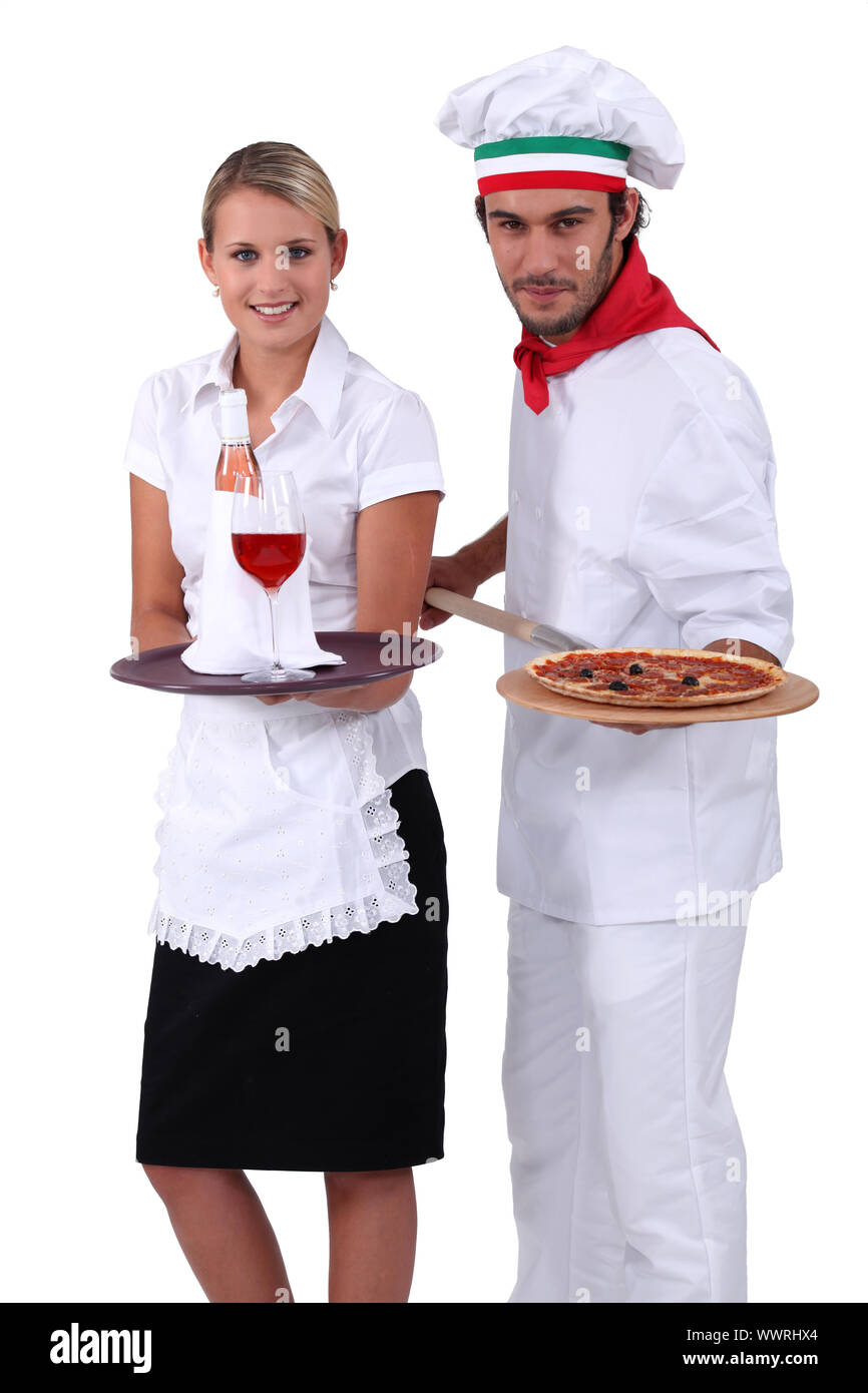 Pizza chef standing next to a wine waitress Stock Photo - Alamy