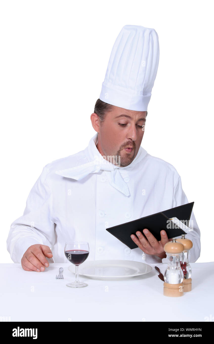Chef choosing food from his own menu Stock Photo - Alamy