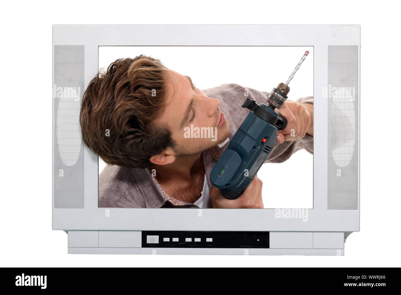 Man drilling inside television Stock Photo - Alamy