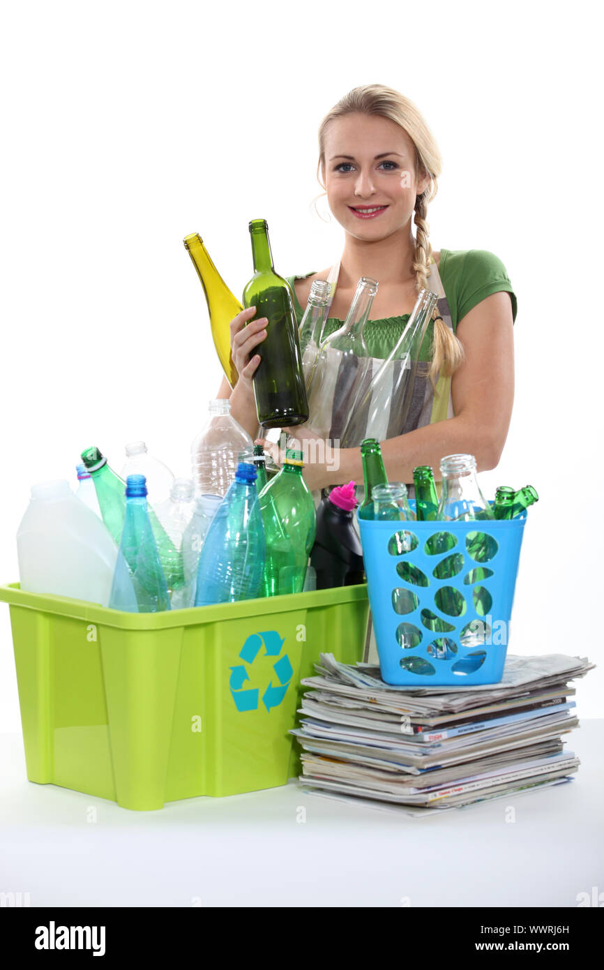 Blond woman recycling Stock Photo - Alamy