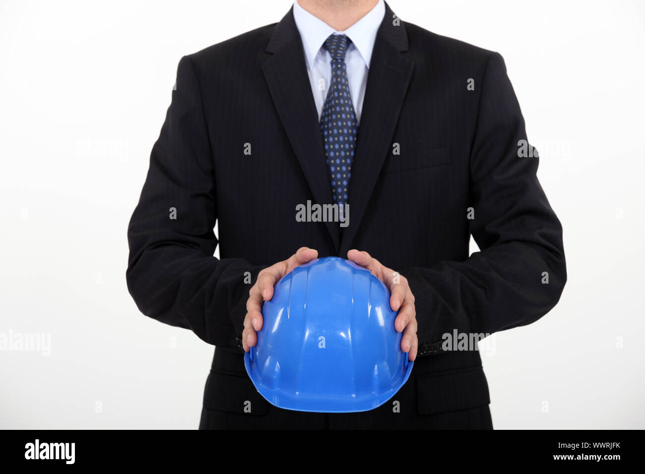 Architect holding his hard hat Stock Photo - Alamy