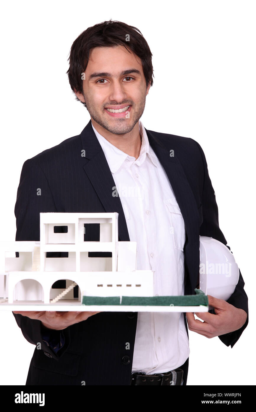 Architect holding scale model of housing Stock Photo - Alamy Architect holding scale model of housing Stock Photo - Alamy