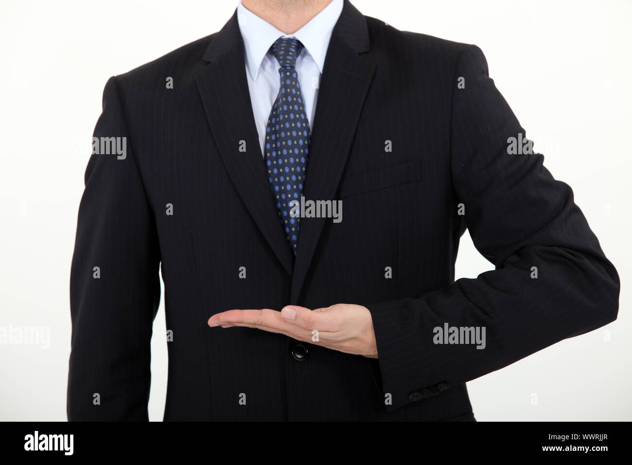 Businessman with his hand held flat Stock Photo - Alamy