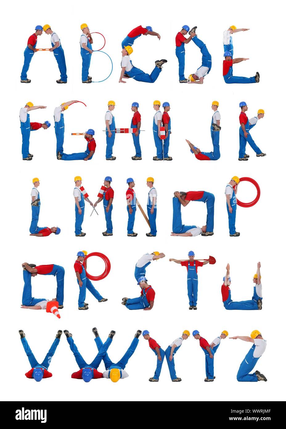 Builders forming the alphabet Stock Photo - Alamy