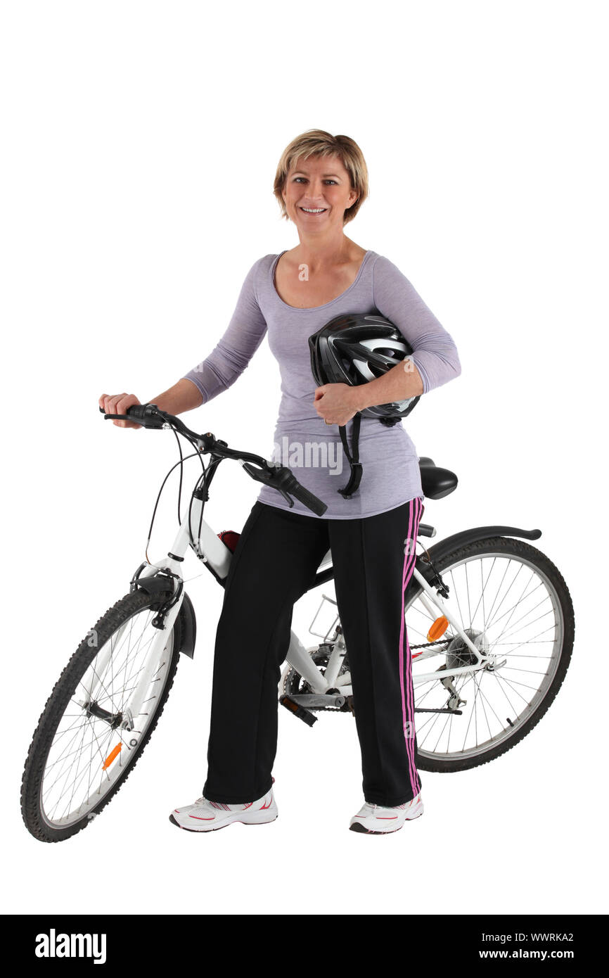 Woman walking her bicycle Cut Out Stock Images & Pictures - Alamy