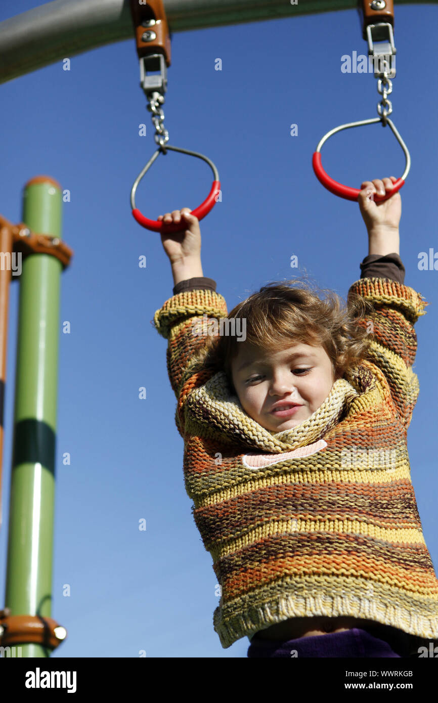 Child in a playground Stock Photo - Alamy