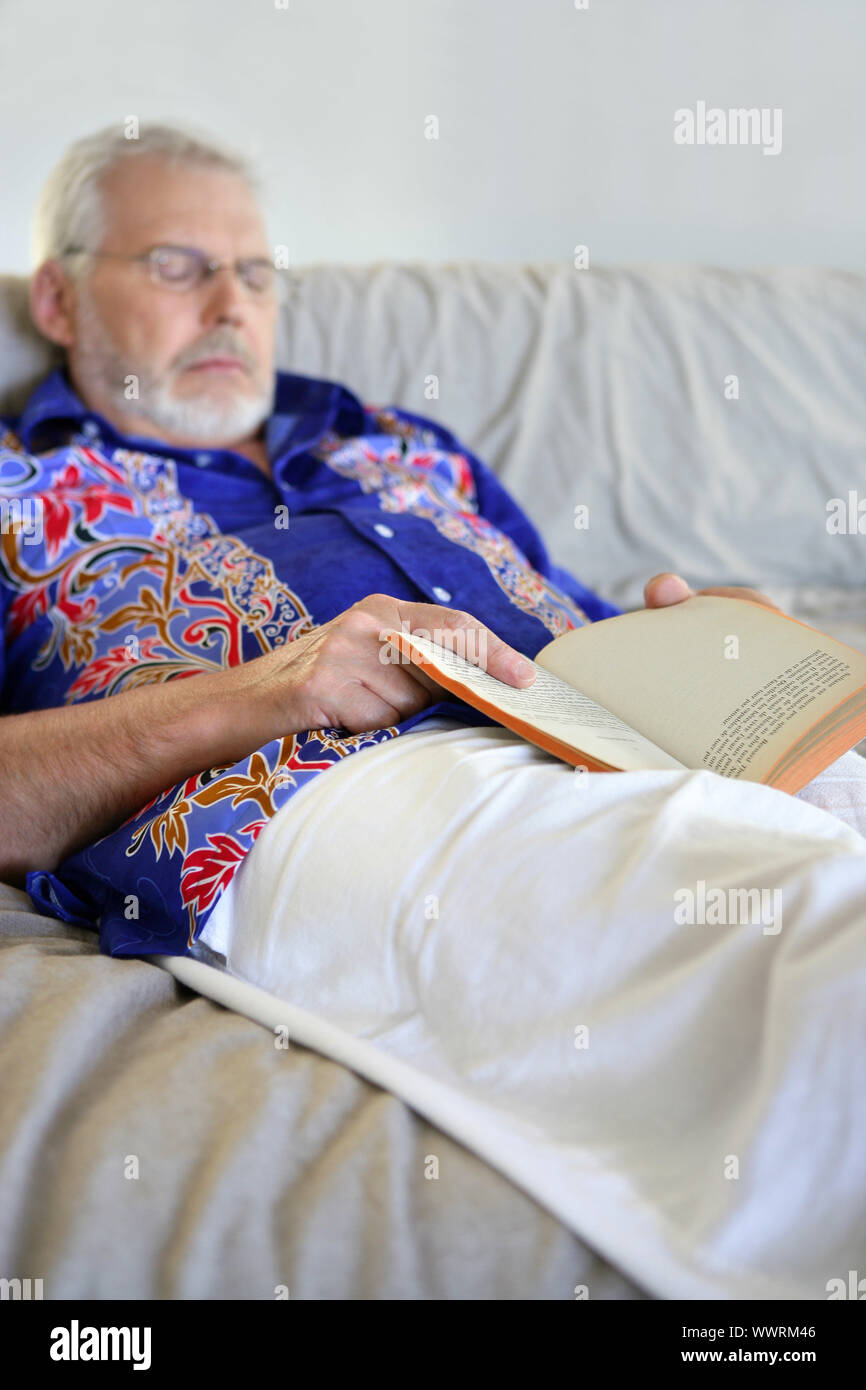 Old man having a nap on the sofa Stock Photo - Alamy