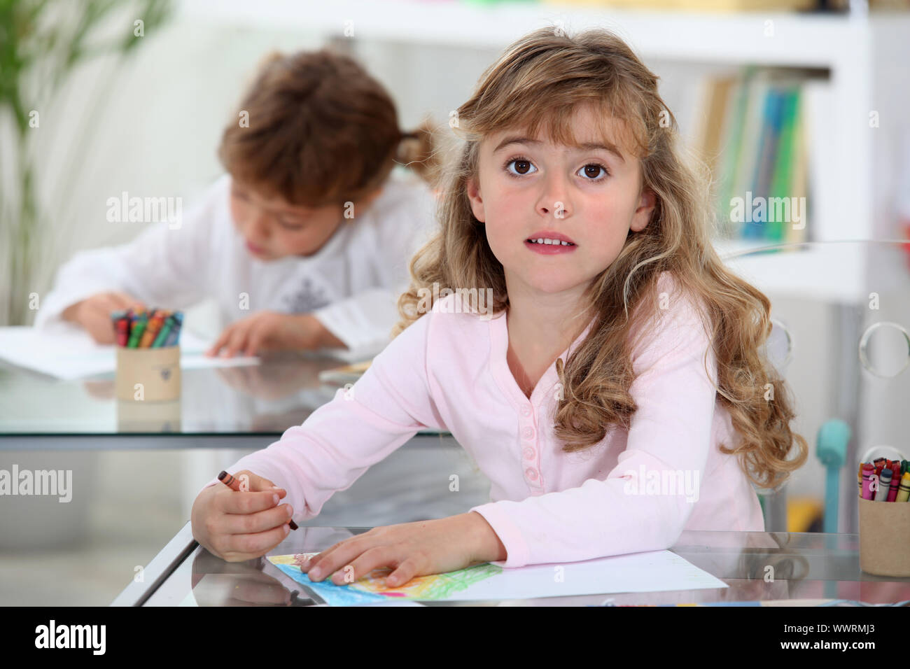 two kids studying in a classroom Stock Photo - Alamy