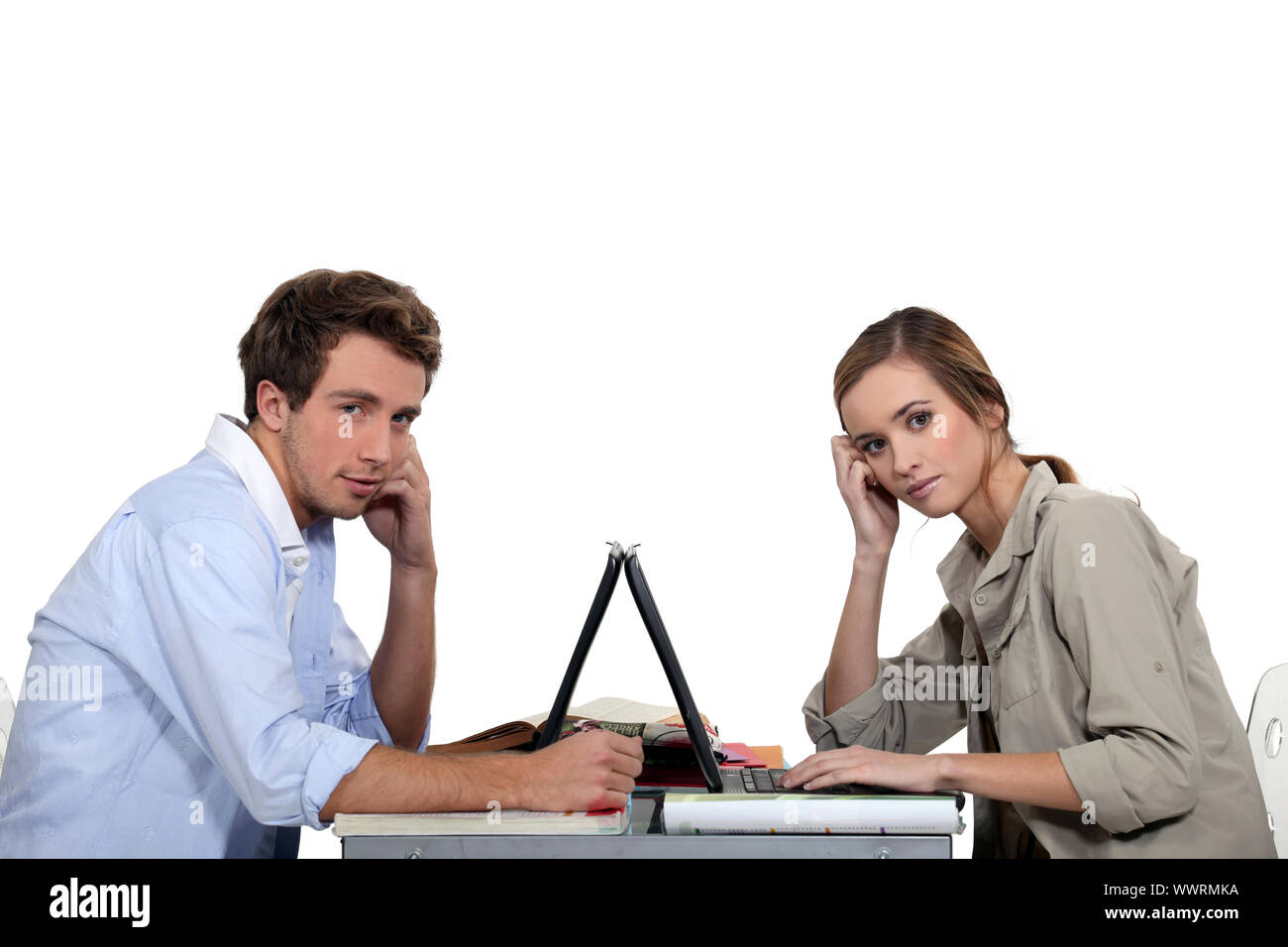 Boy and girl face to face with laptop computers Stock Photo - Alamy