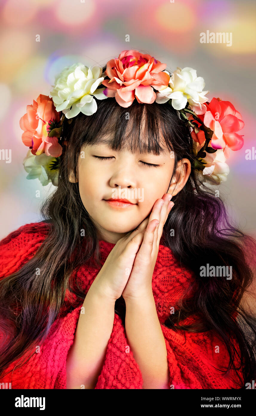 Cute asian little girl with wreath of flowers on her head Stock Photo ...