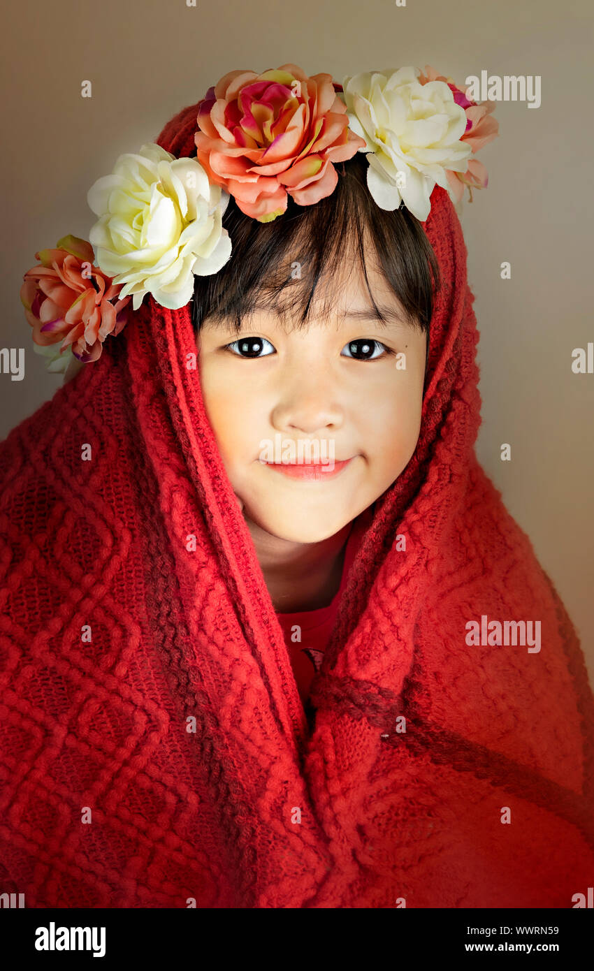 Cute asian little girl with wreath of flowers on her head Stock Photo ...
