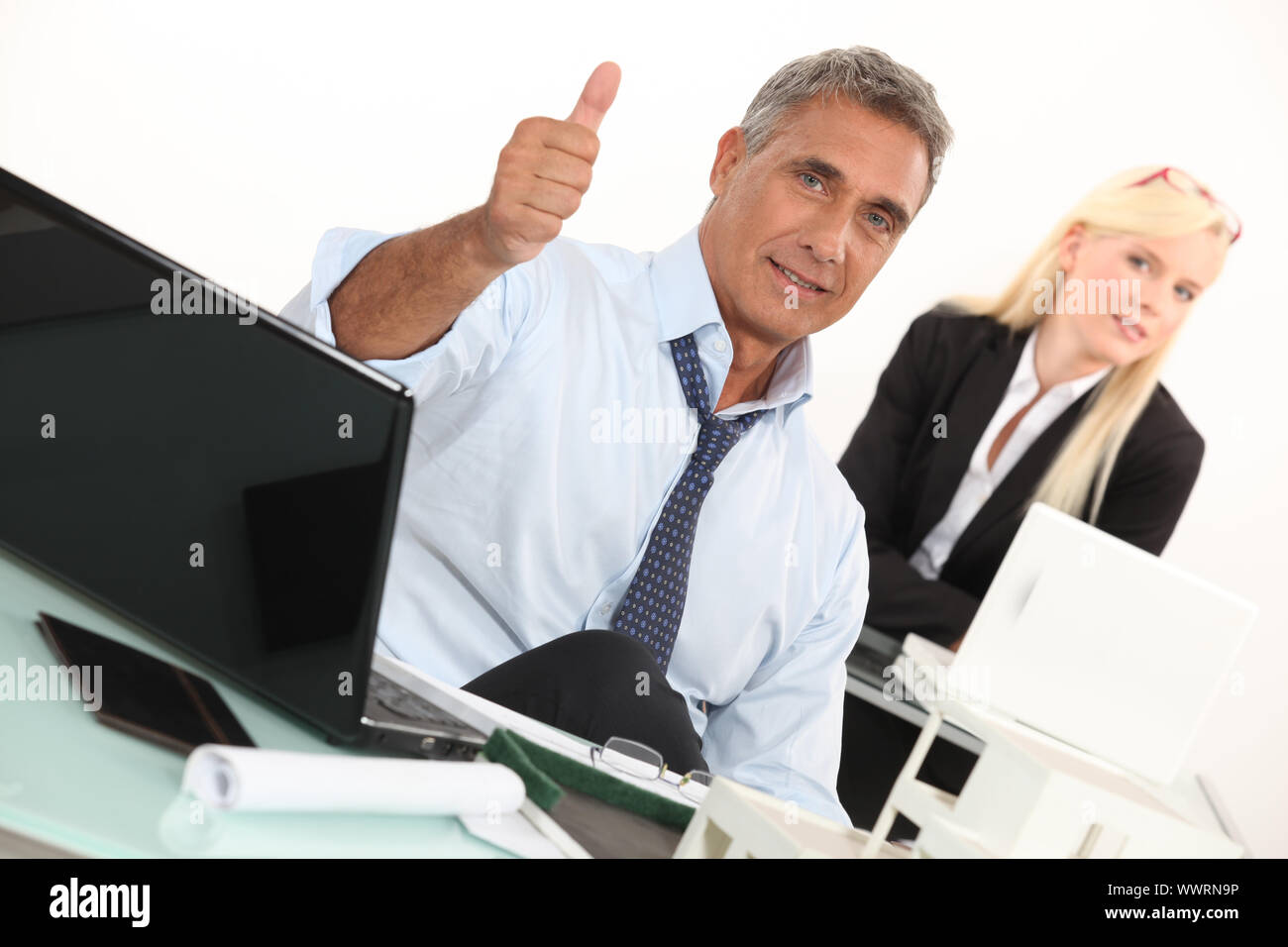 Estate agent with thumbs up Stock Photo - Alamy