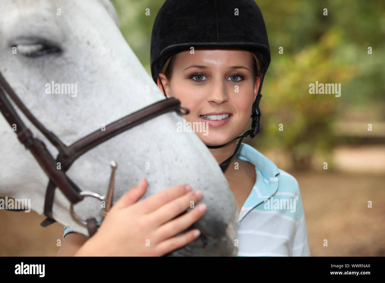 Rider with white horse Stock Photo - Alamy