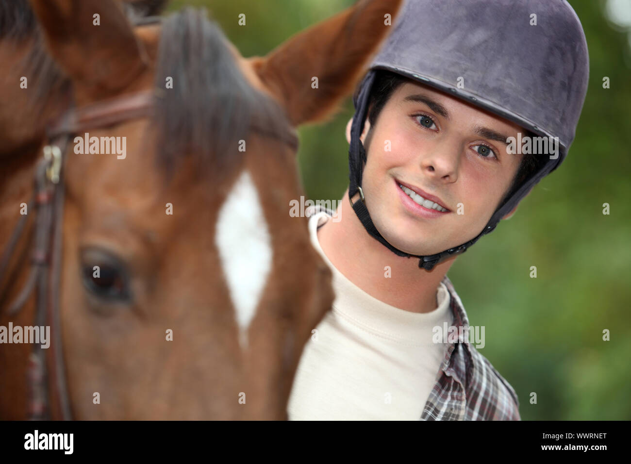 young man riding a horse Stock Photo - Alamy