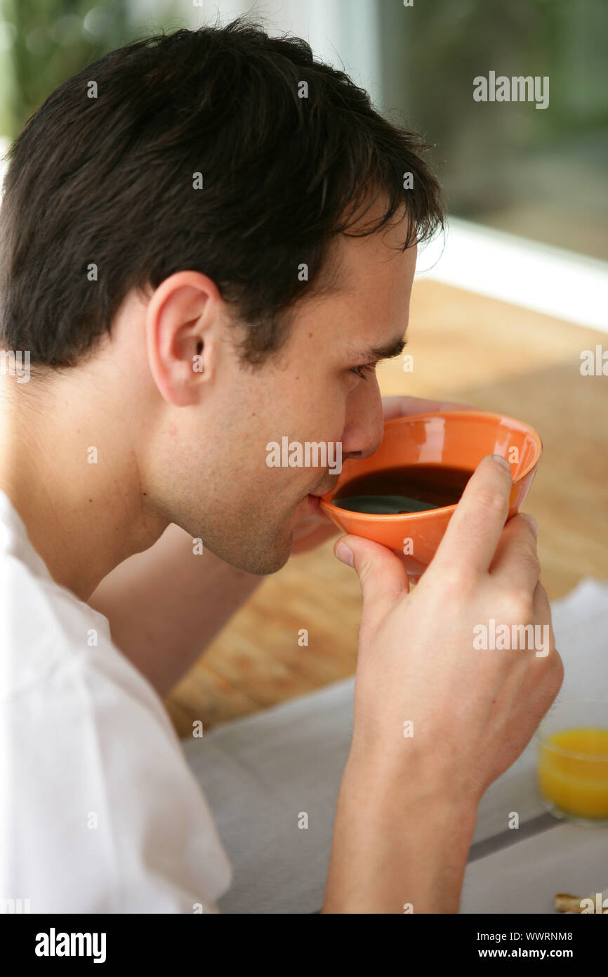 Man drinking morning coffee Stock Photo - Alamy