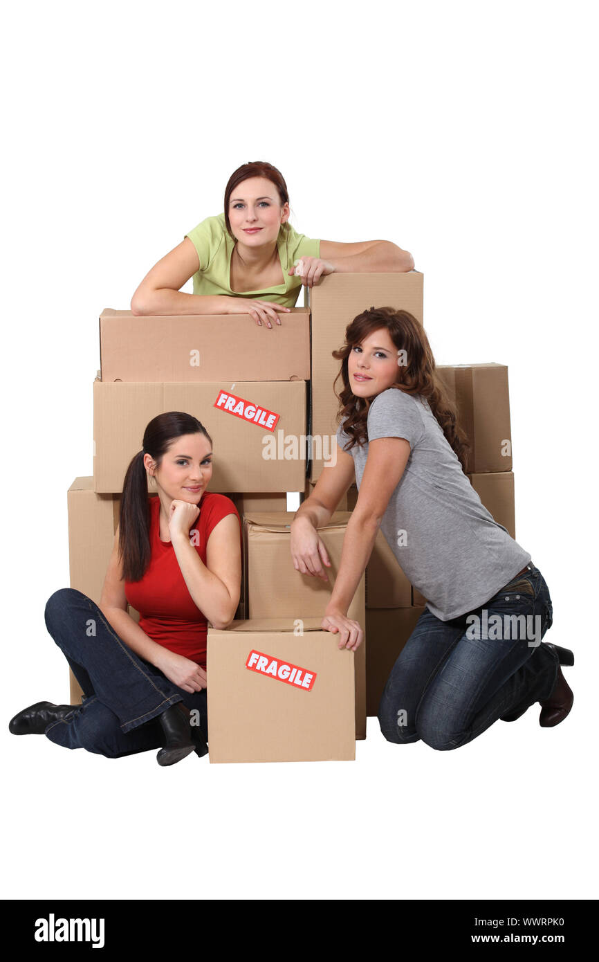 Friends with packing boxes Stock Photo - Alamy