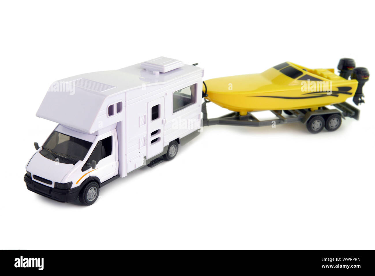 Camping vehicle pulling speed boat on trailer Stock Photo - Alamy