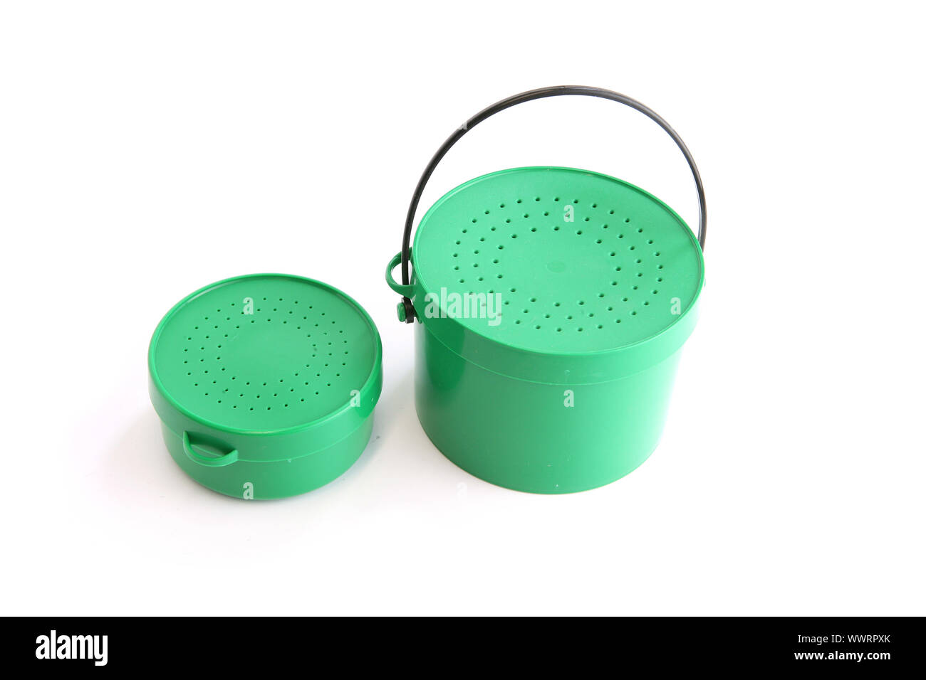 Two green tins with perforated lids Stock Photo - Alamy