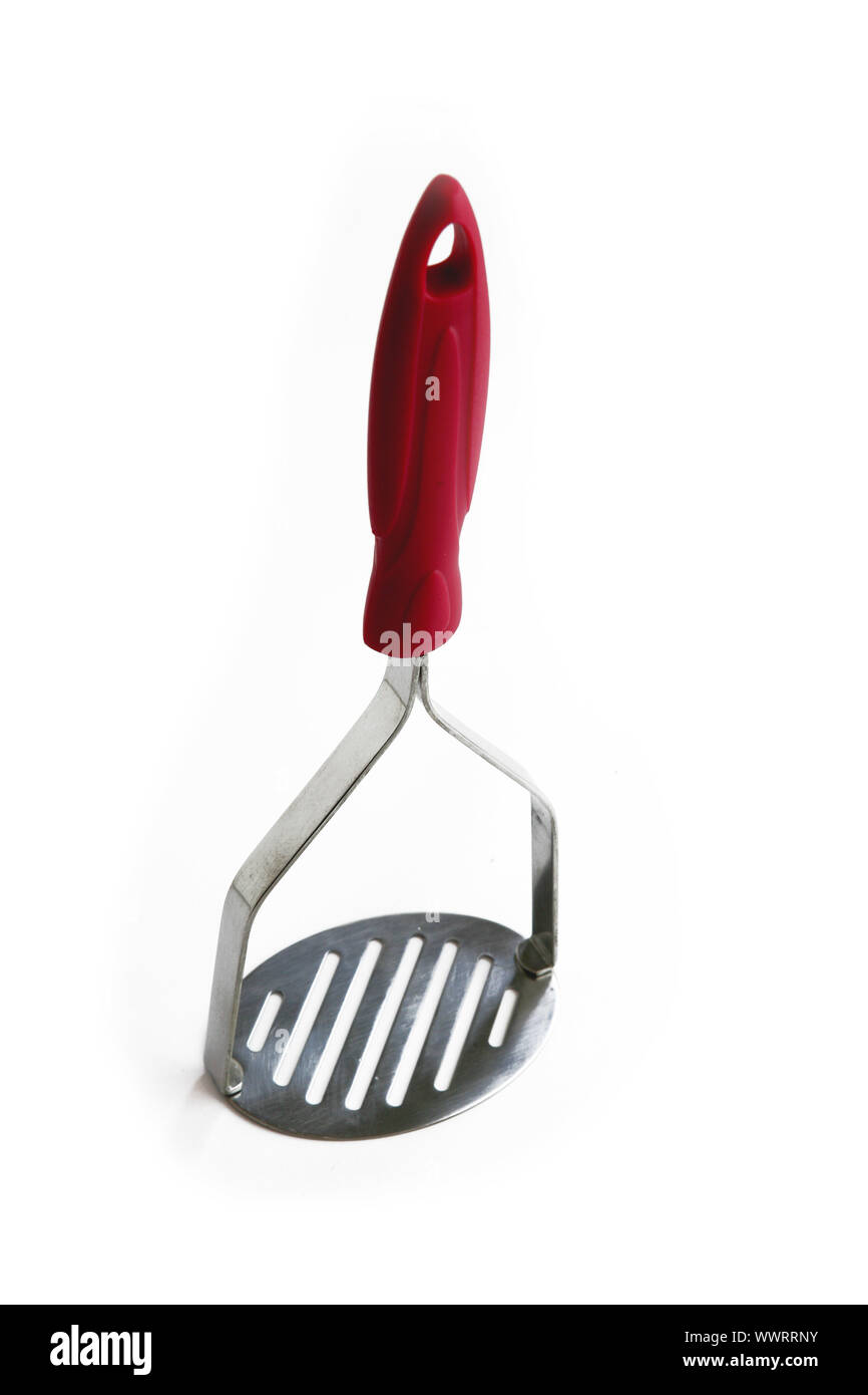 Silver potato masher with red handle Stock Photo - Alamy