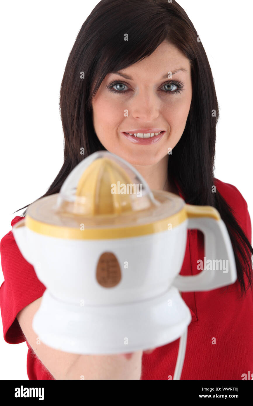 Woman holding an electric lemon squeezer Stock Photo - Alamy