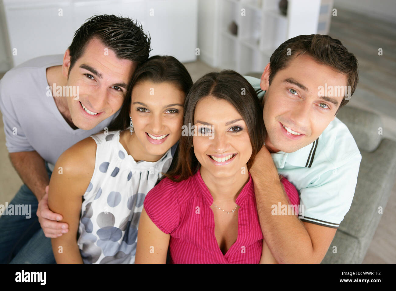 Two couples at home Stock Photo - Alamy