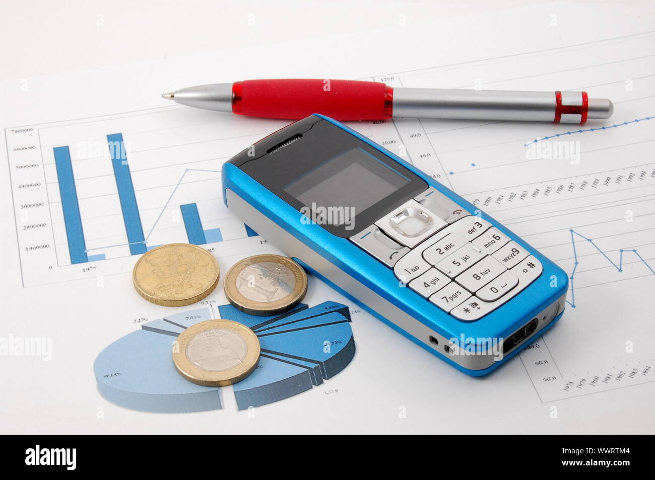 blue cell phone over business chart showing success Stock Photo - Alamy